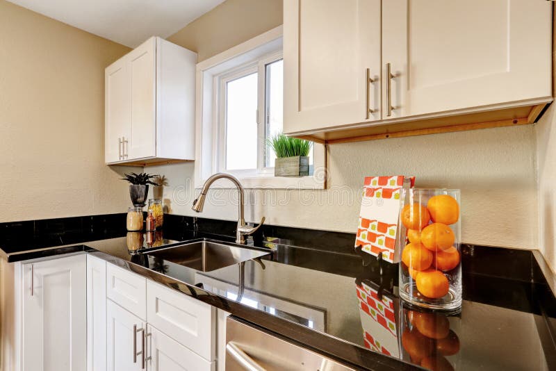 Nice Kitchen with Black Counters. Stock Photo - Image of bright, estate ...