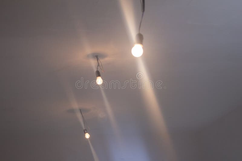 Nice Light Bulbs without Lamps Furniture on a Ceiling Stock Photo ...