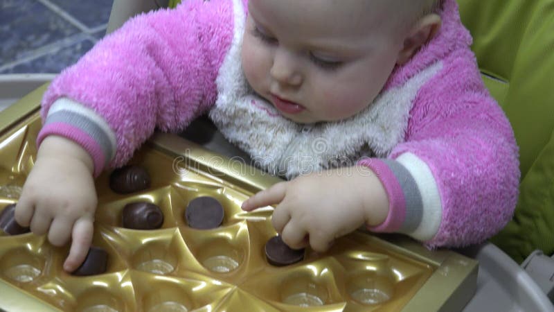 Nice Little Baby and First Candy. Closeup. 4K UltraHD, UHD Stock ...