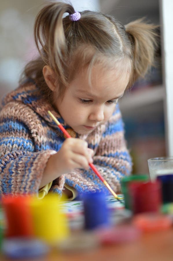Nice little girl painting stock photo. Image of portrait - 42682620