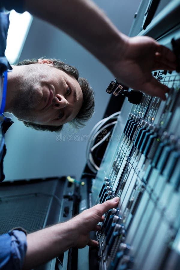 Nice Male Engineer Working with the Network Server Stock Image - Image ...