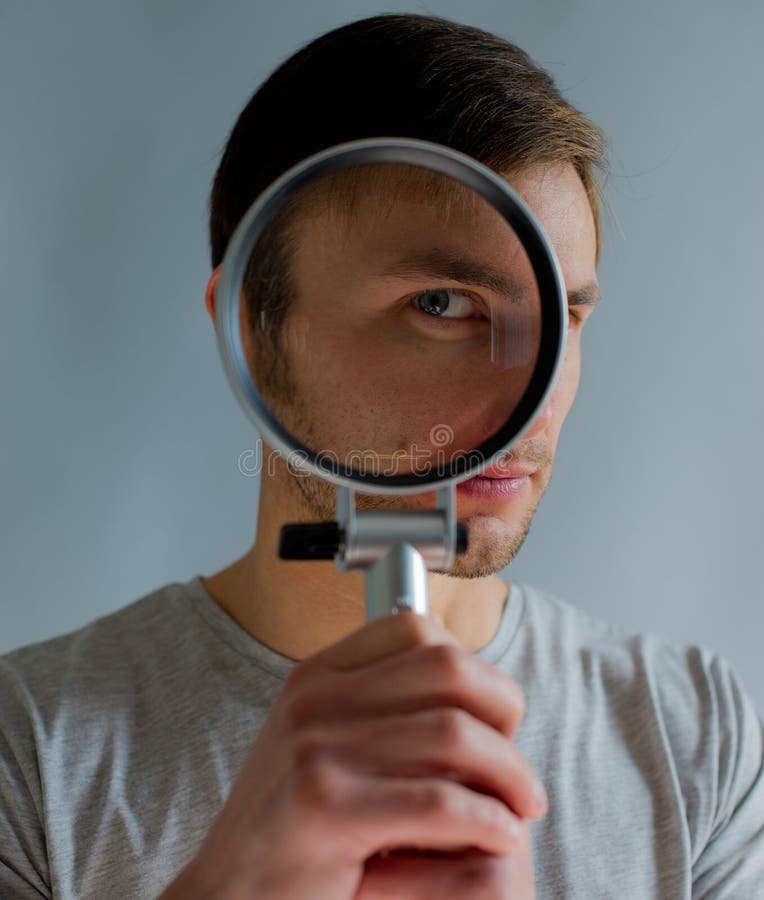 Guy with magnifying glass stock image. Image of caucasian - 30211889