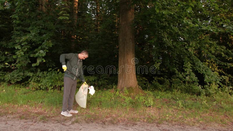 Nice Man Picking Up Litter in Nature Stock Footage - Video of ...