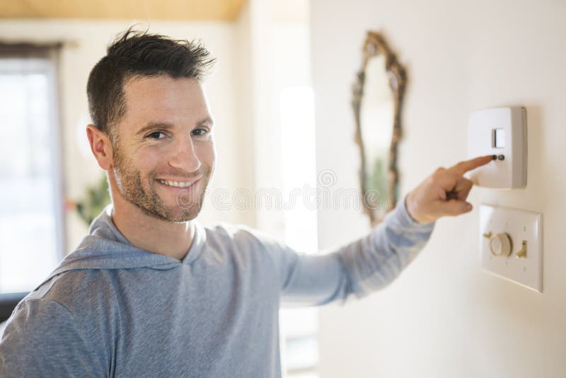 Nice Man Set the Thermostat at House Stock Photo - Image of caucasian ...