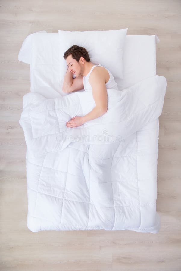 Nice man sleeping in bed stock photo. Image of bedclothes - 67356158