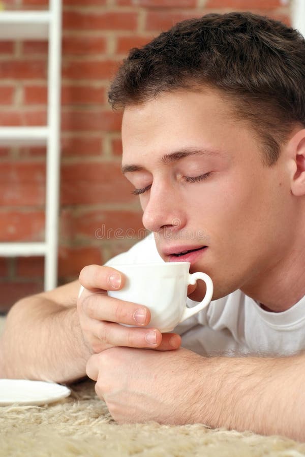 Nice man with tea stock photo. Image of coffee, carpet - 23055276