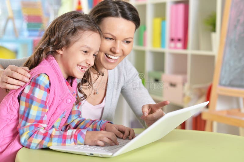 Mother and Daughter Using Laptop at Home Stock Image - Image of mother ...