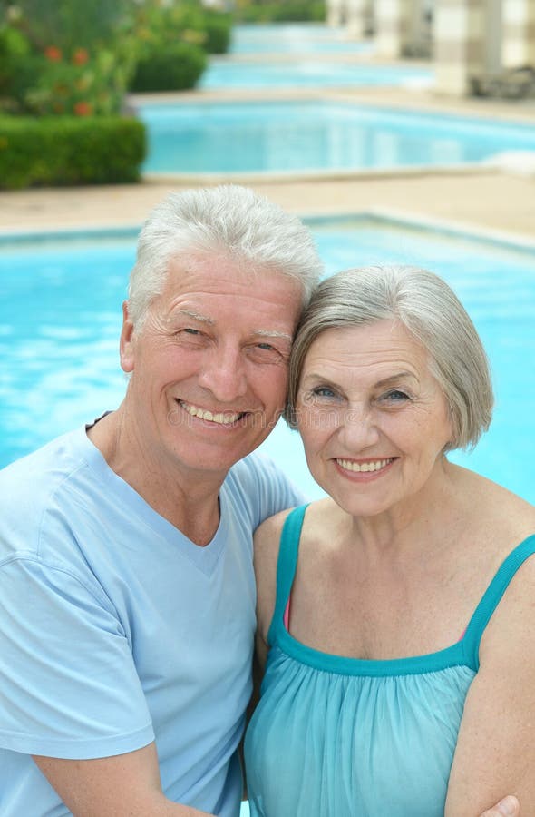 Nice old couple at pool stock image. Image of leisure - 39125065