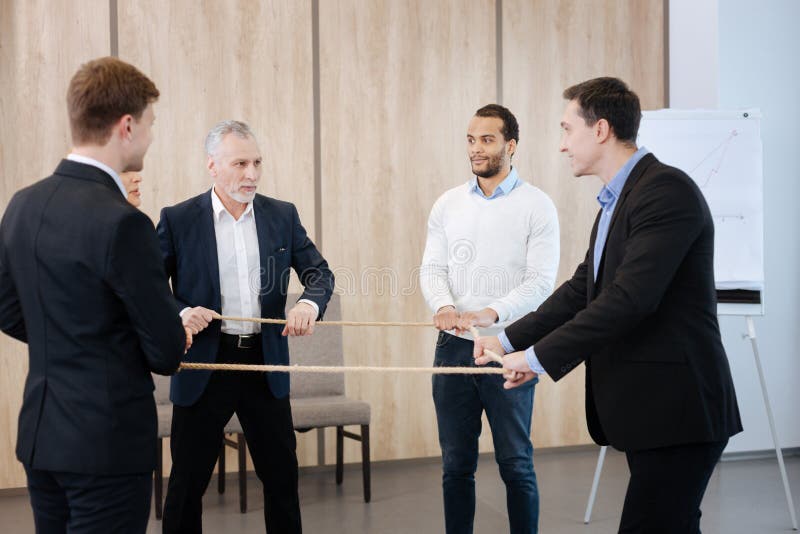 Nice Pleasant People Holding the Rope Stock Photo - Image of ...