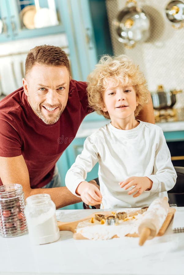 Nice Positive Father and Son Cooking Together Stock Image - Image of ...