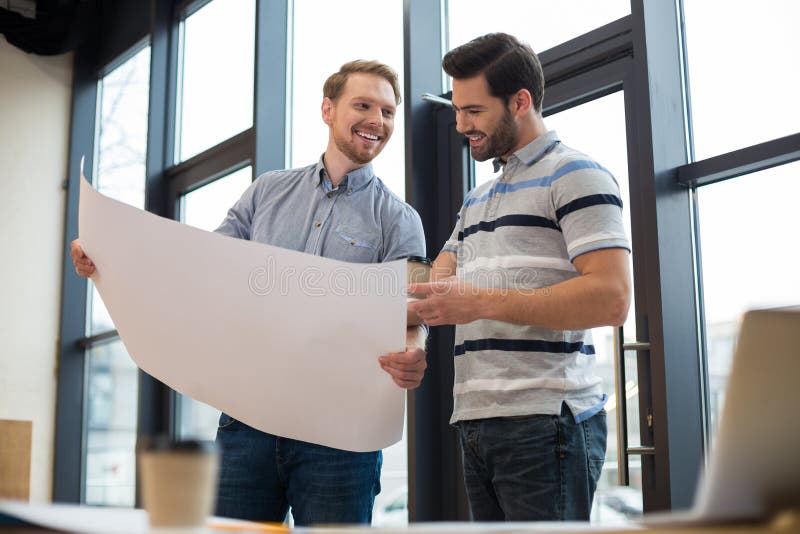Nice Positive Men Discussing Their Project Stock Photo - Image of ...