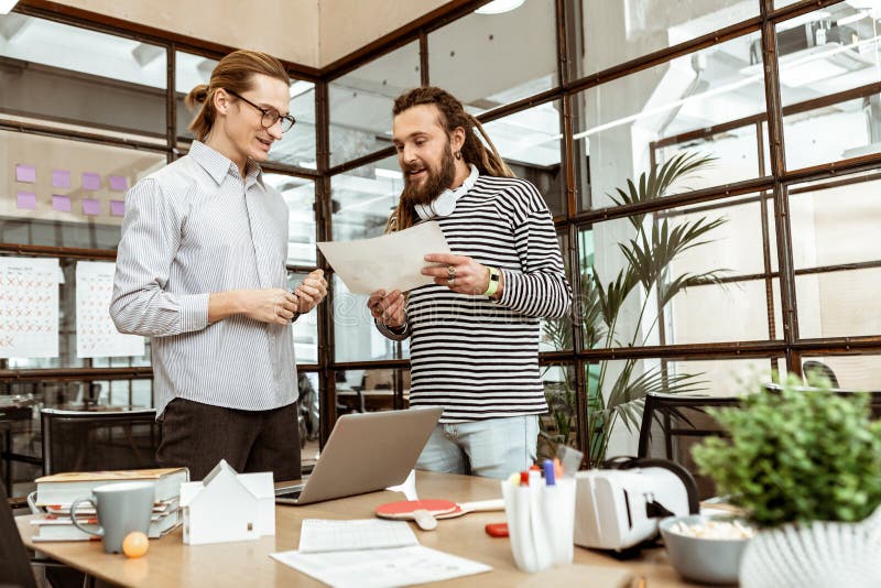 Nice Positive Young Colleagues Discussing Their Work Stock Photo ...