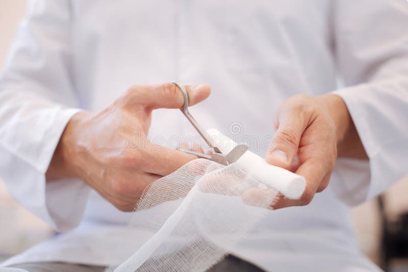 Nice Professional Doctor Preparing a Bandage Stock Image - Image of ...