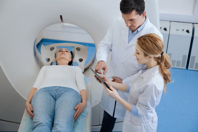 Nice Professional Doctors Using a Tablet Stock Image - Image of ...