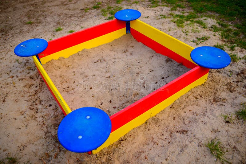 A Nice Sandbox Playground Filled . Surrounded by Green Grass, Stock ...