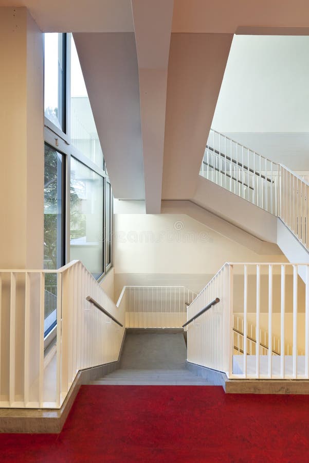 Large Staircase of Modern Public School with Red Floor and White ...