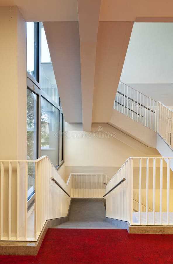 Large Staircase of Modern Public School with Red Floor and White ...