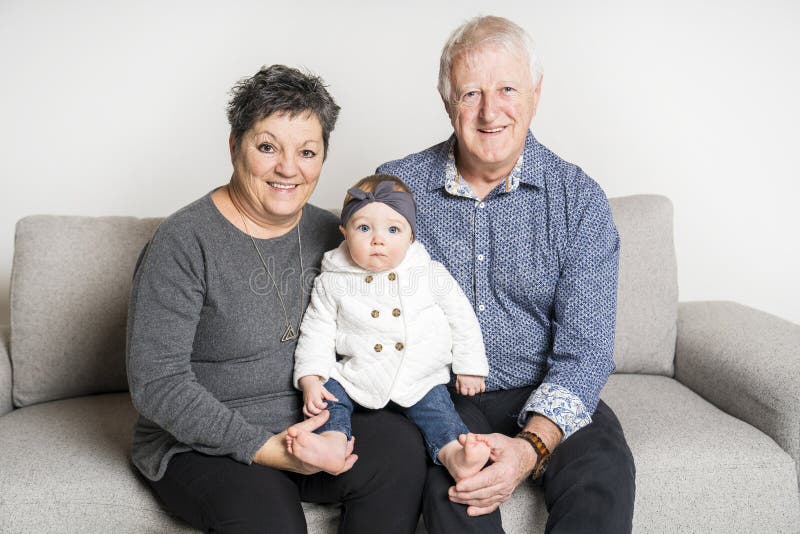 Senior Couple with Baby Granddaughter Stock Image - Image of horizontal ...