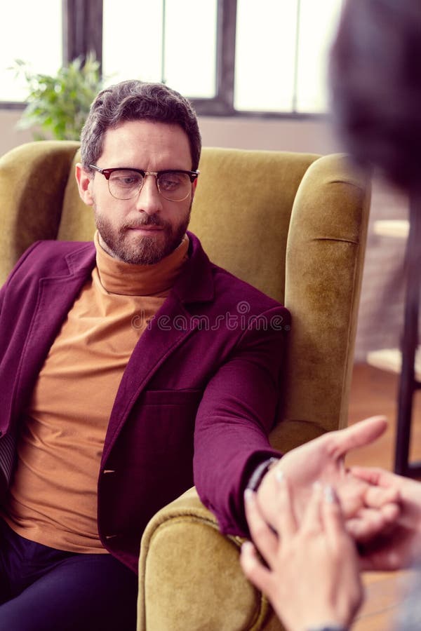 Nice Serious Smart Man Looking at His Hand Stock Photo - Image of ...