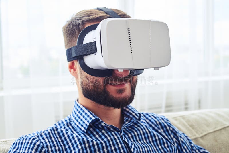 Nice Smiling Man in VR Glasses Sitting on Sofa Stock Image - Image of ... Nice Smiling Man in VR Glasses Sitting on Sofa Stock Image - Image of ...
