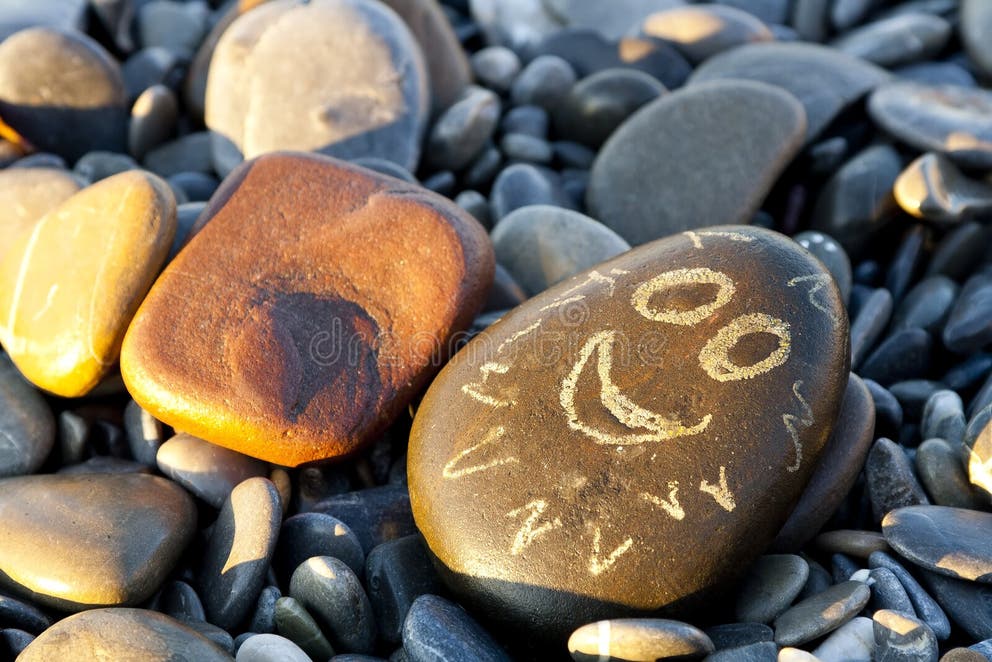 A Nice Stone with a Painted Face Stock Photo - Image of gray, brick ...