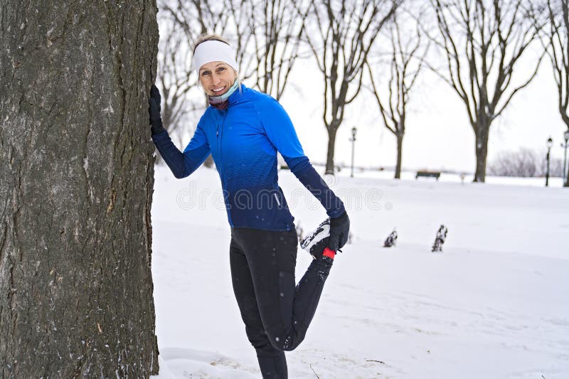 Nice Stretching Young Woman Running in Snowy Park Stock Image - Image ...