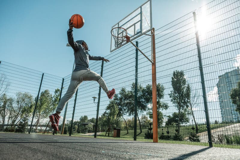 Nice Strong Man Jumping while Throwing a Ball Stock Image - Image of ...