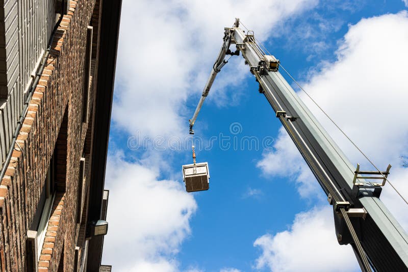 Aerial lift with a basket. editorial stock image. Image of impression ...