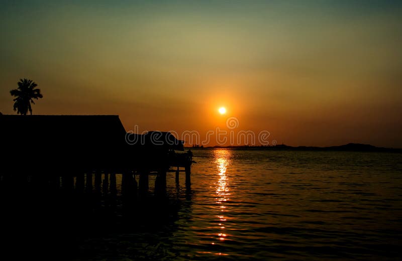 Nice Sunset Sky at Sea with Silhouette of House Stock Photo - Image of ...