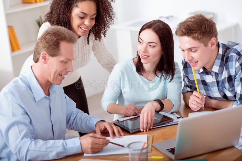 Nice Teacher Sitting with His Students Stock Image - Image of digital ...