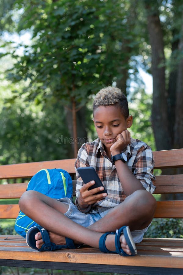 Nice Thoughtful Boy Using His New Smartphone Stock Photo - Image of ...