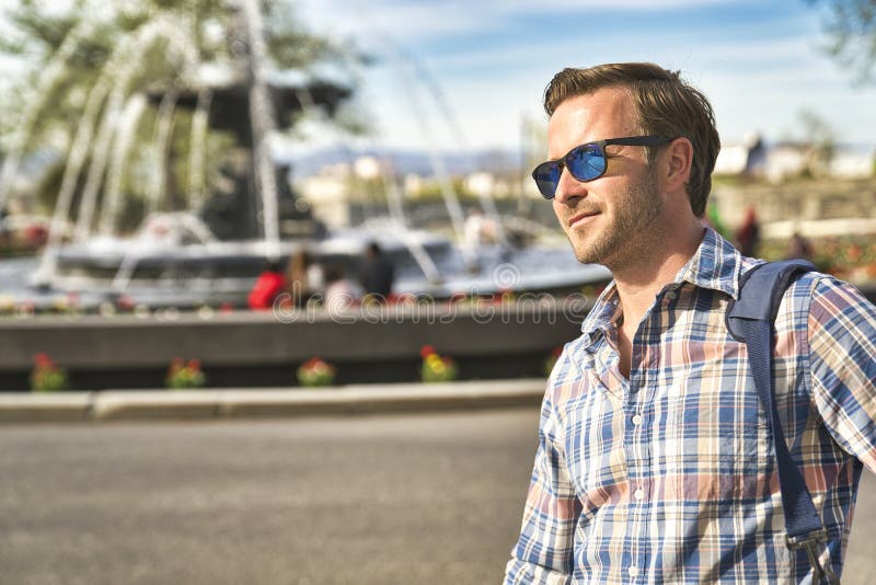 A Nice Tourist Man with Tourny Fountain on the Back Stock Photo - Image ...