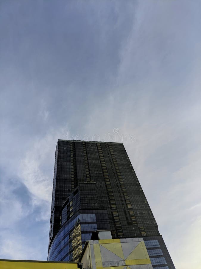 View of the Building Above the Blue Sky and Moving Clouds Stock Image ...