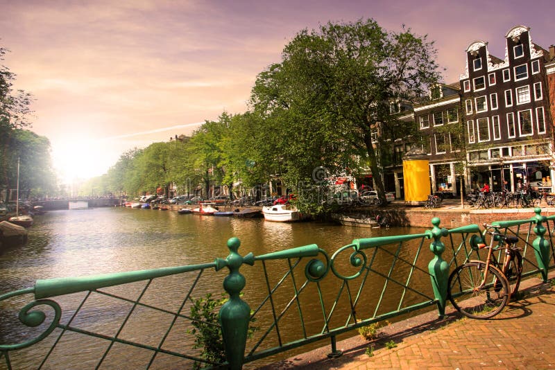 Amsterdam in Netherlands stock image. Image of sunset - 112933175