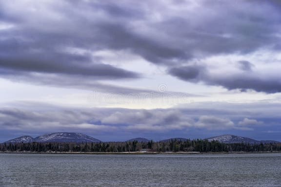 Racoon Cove Wintertime with Clouds Stock Photo - Image of dark, snow ...