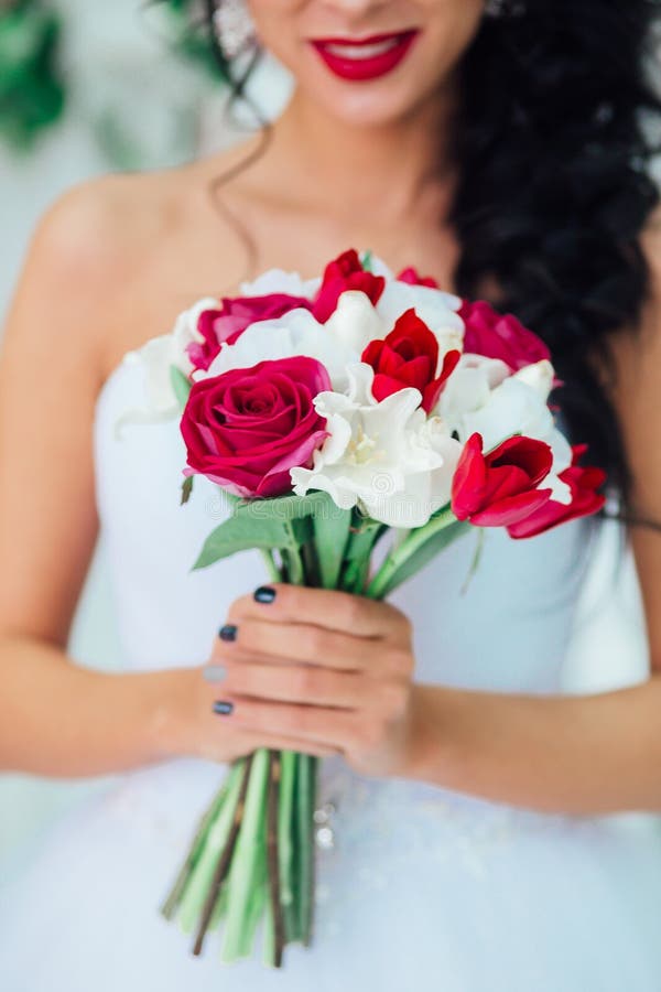 Nice Wedding Bouquet in the Hands of the Bride Stock Photo - Image of ...