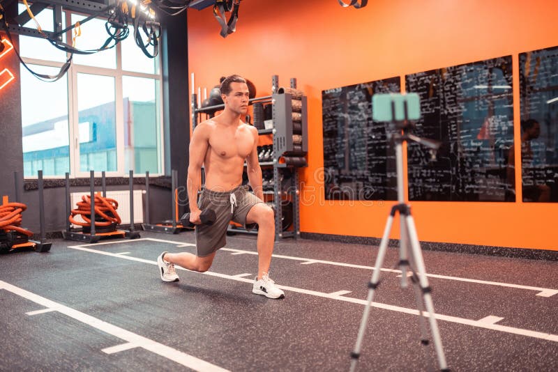 Nice Well Built Man Showing the Exercise with Dumbells Stock Image ...