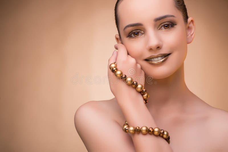 The Nice Woman Wearing Elegant Jewellery Stock Photo - Image of golden ...