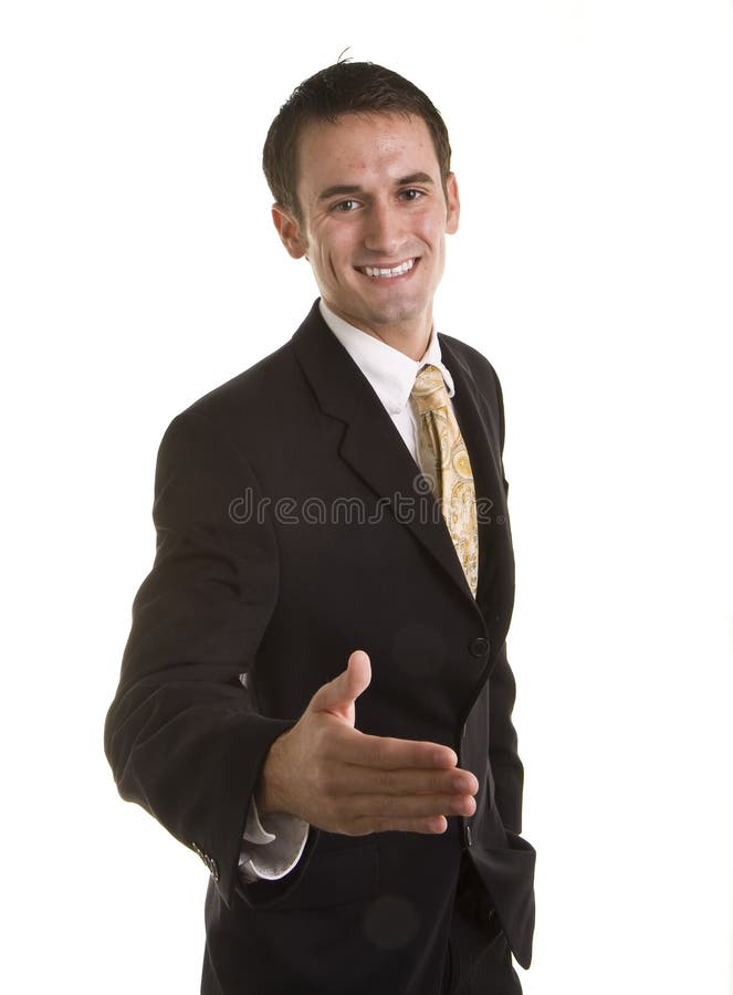 Nice Young Man in Business Suit Extending Hand Stock Photo - Image of ...
