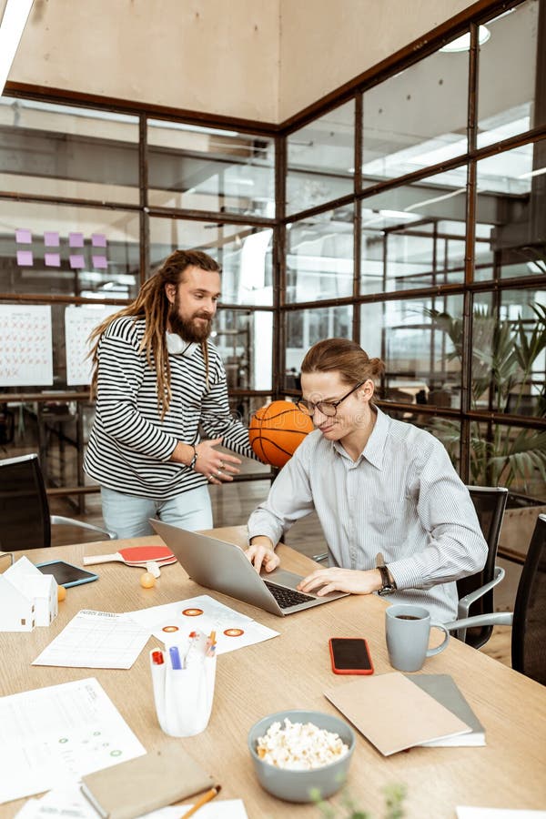 Nice Young Man Focusing on His Work Stock Photo - Image of indoors ...