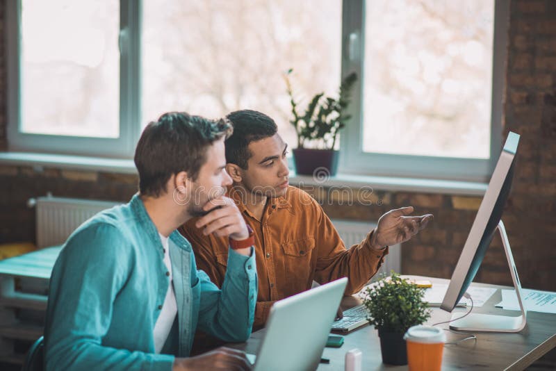 Nice Young Man Pointing at the Computer Screen Stock Image - Image of ...