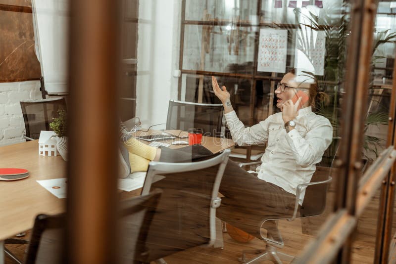 Nice Young Man Speaking on the Phone Stock Photo - Image of indoors ...