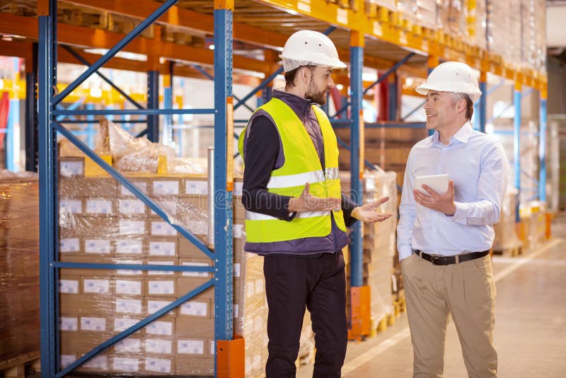 Nice Young Man Talking To the Logistics Manager Stock Photo - Image of ...