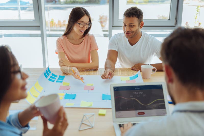 Nice Young People Sitting Around the Table Stock Photo - Image of ...
