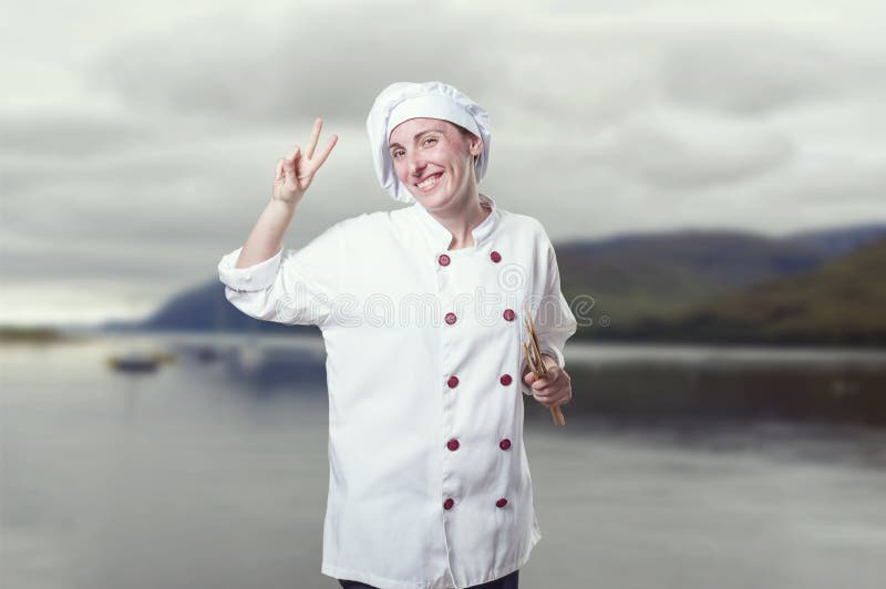Nice Young Woman Chef Making Victory Gesture Stock Photo - Image of ...