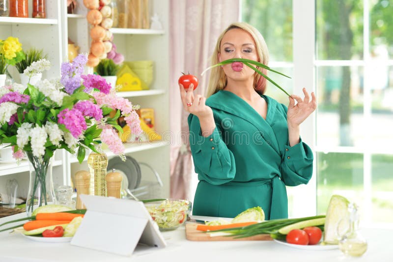 Cute Young Woman Cooking Salad in Kitchen Stock Photo - Image of adult ...