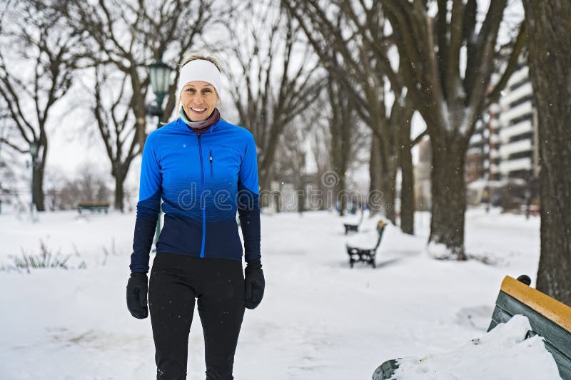 Nice Young Woman Running in Snowy Park Stock Image - Image of workout ...