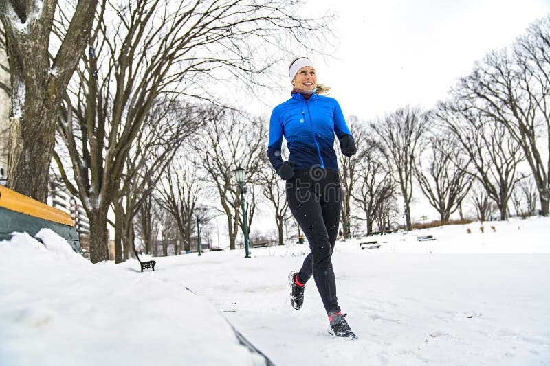 Nice Young Woman Running in Snowy Park Stock Photo - Image of young ...