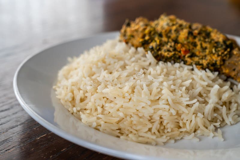 Nigerian Egusi Melon Soup Served with White Rice at Restaurant Stock ...