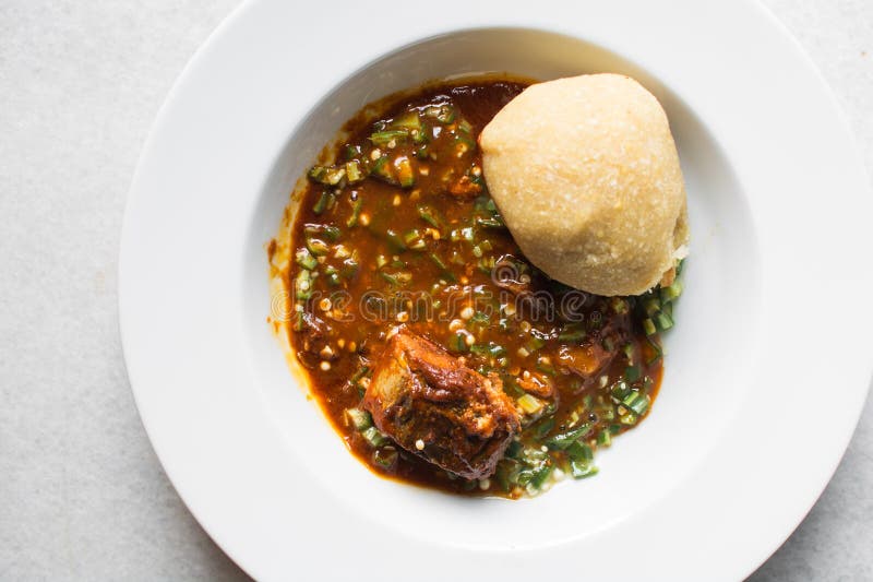 Nigerian Okro and Stew with Eba in a White Plate Stock Image - Image of ...